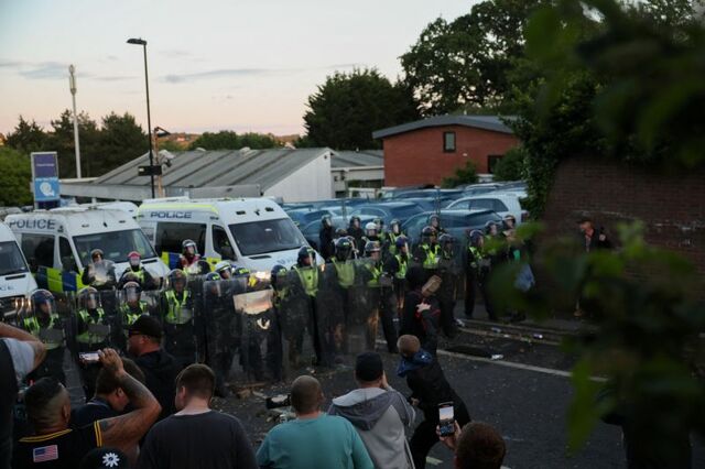 UK interior minister condemns violent reaction to handcuffed student’s ...